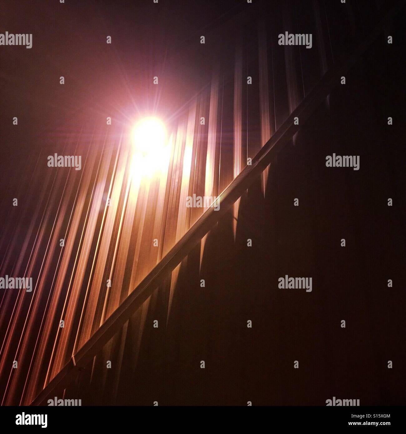 A light outside a commercial building at night Stock Photo - Alamy