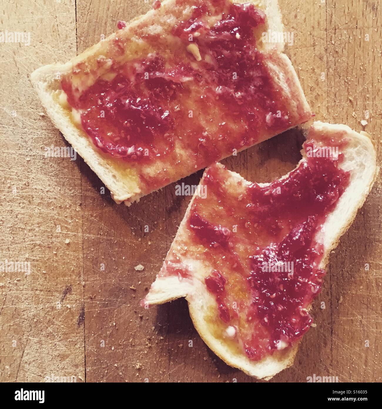 Toast with hand made strawberry and raspberry jam Stock Photo - Alamy