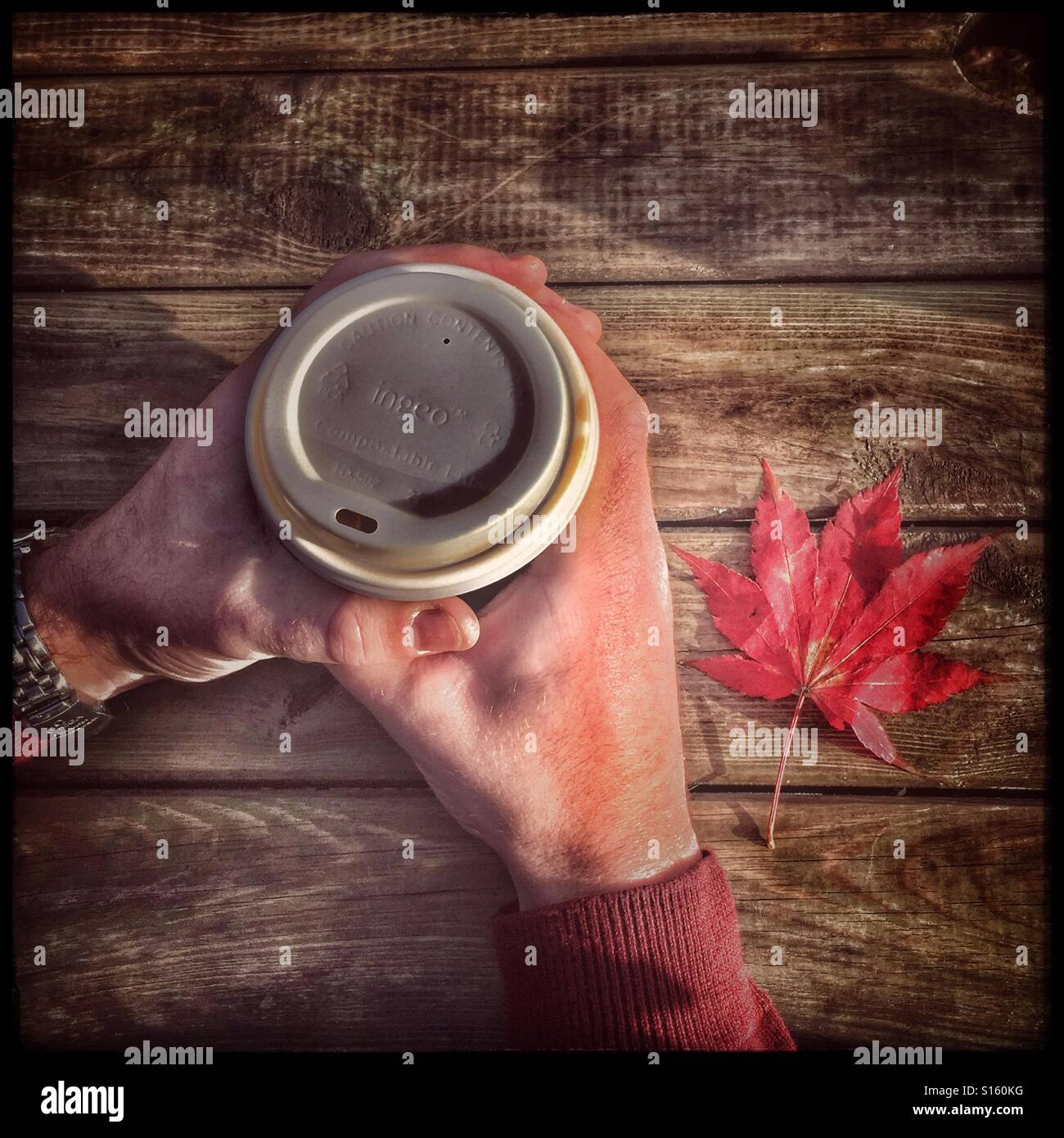 Man warming hands on cup hi-res stock photography and images - Alamy