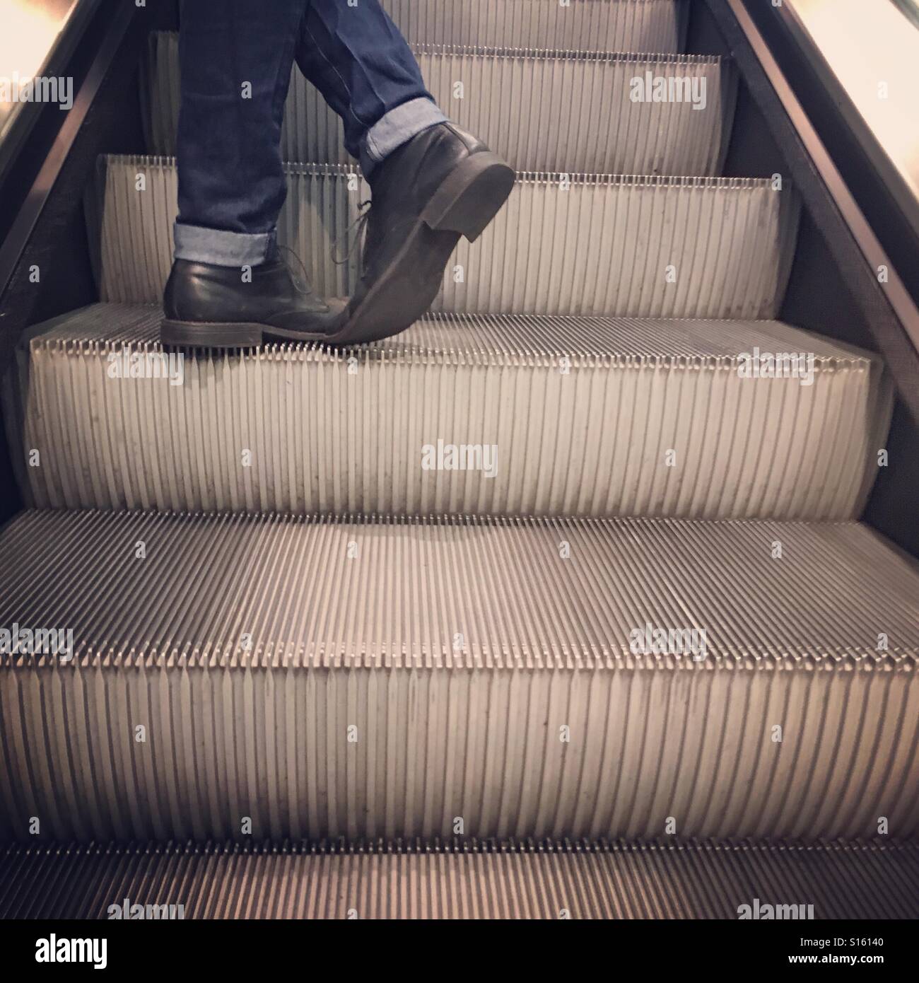 Feet on escalator hi-res stock photography and images - Alamy