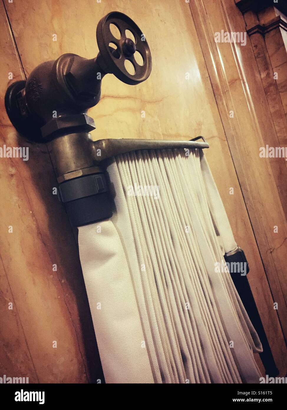 Firehose and standpipe firefighting equipment in stairwell Stock Photo ...