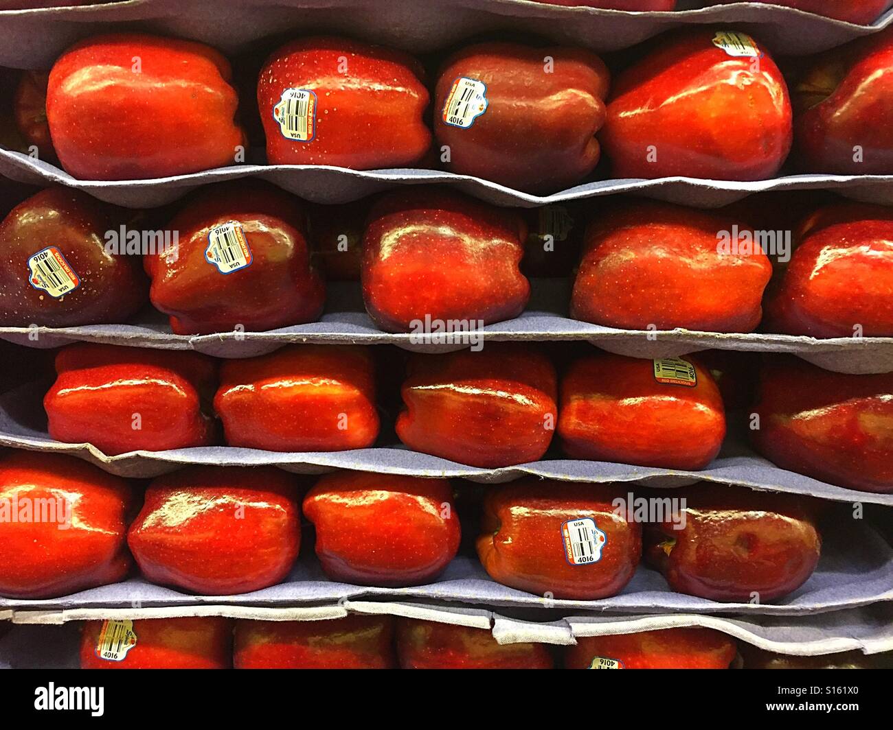 Apples stacked on grocery store shelves on paper pallets Stock Photo ...