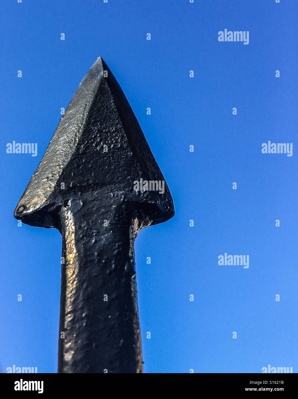 Metal arrow pointing up Stock Photo - Alamy