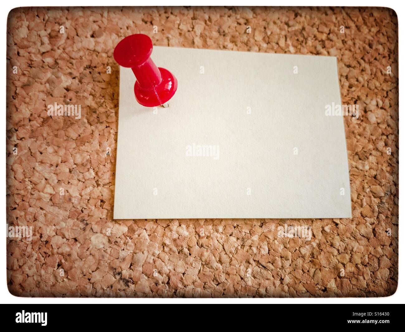 A piece of paper is attached to a pinboard Stock Photo - Alamy