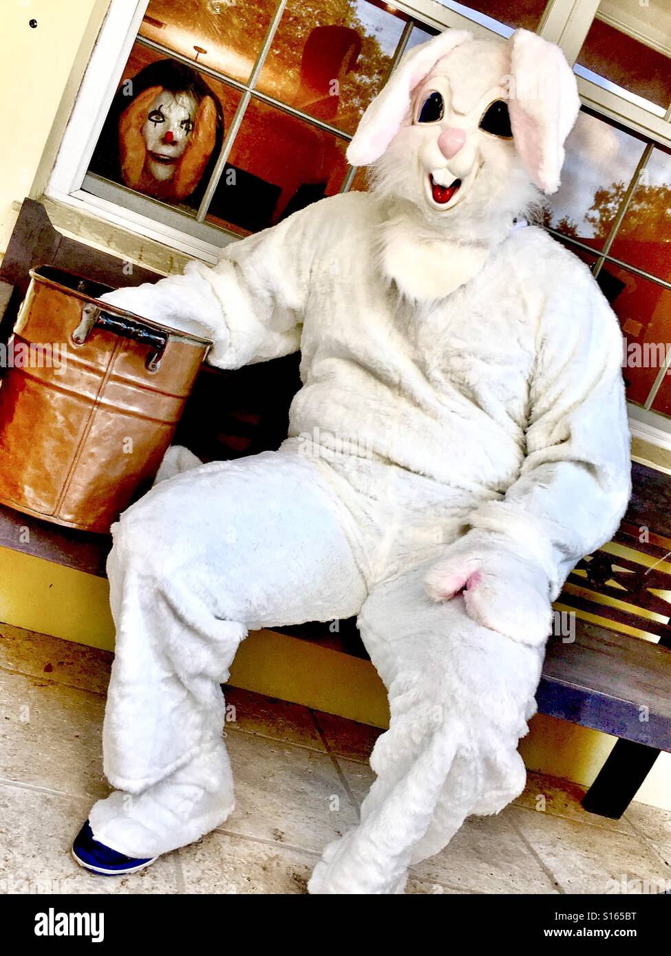 Big white rabbit giving out Halloween candy Stock Photo - Alamy