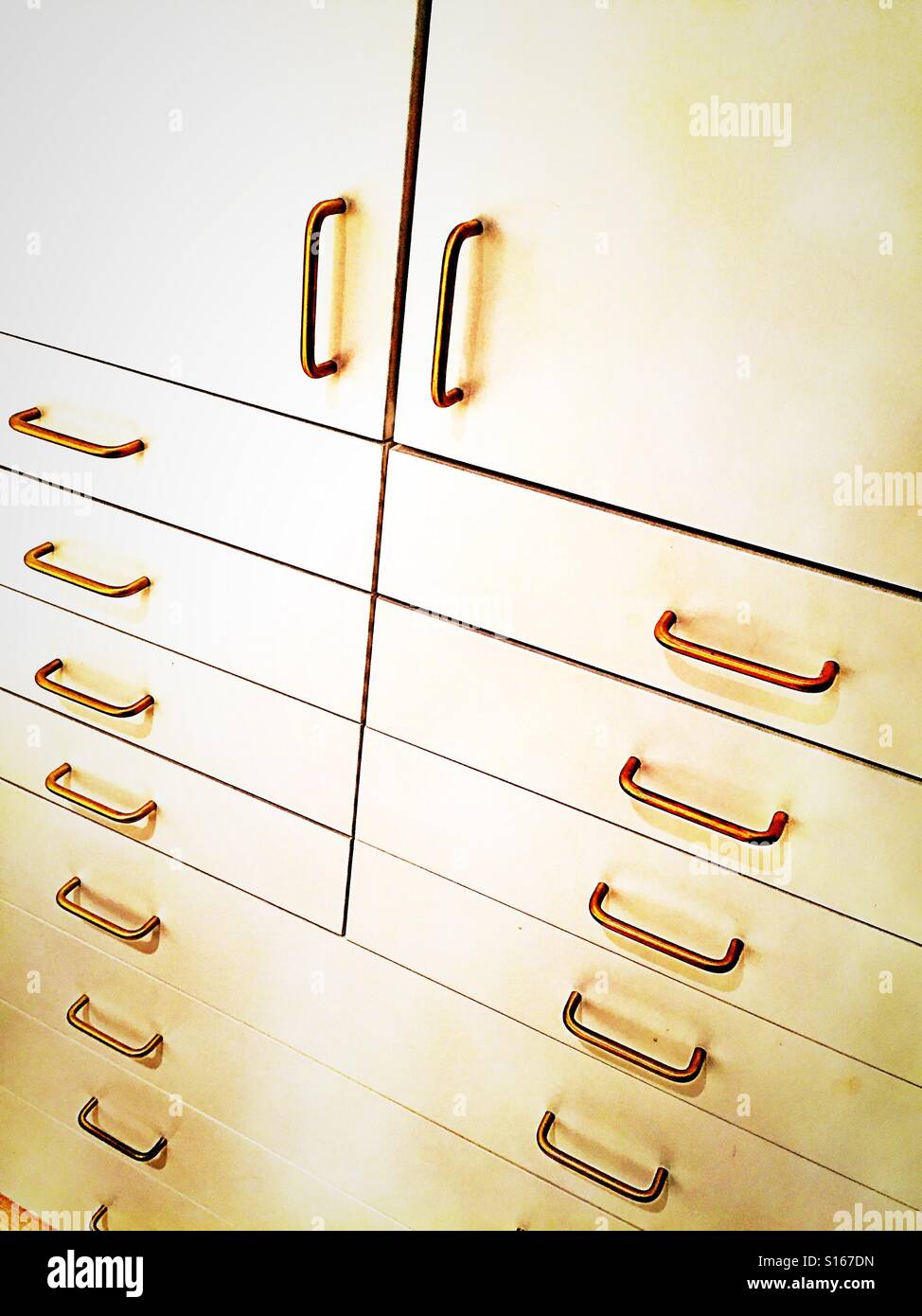 Cabinet with many doors and drawers Stock Photo - Alamy