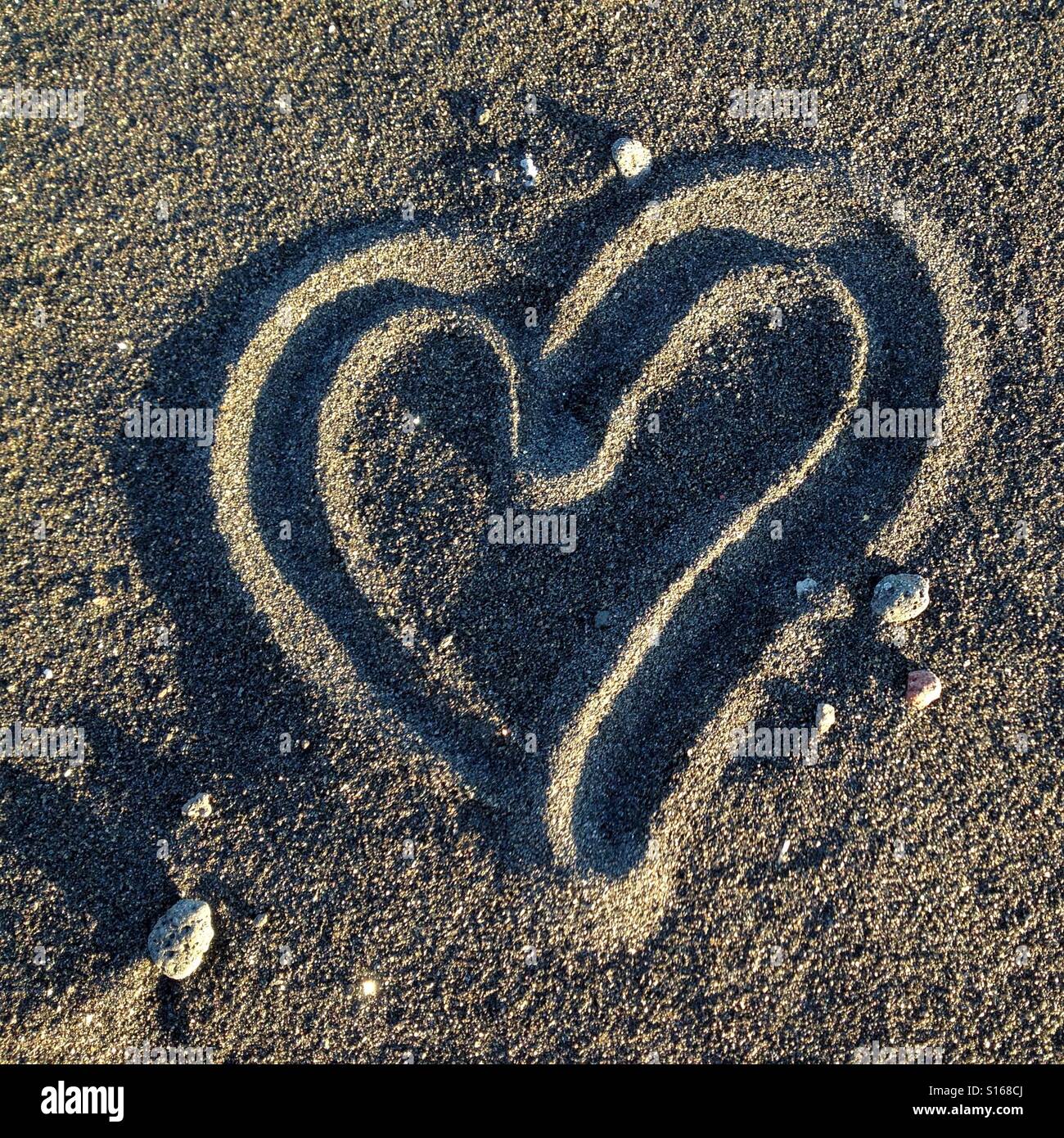 Heart shape drawn in sand hi-res stock photography and images - Alamy
