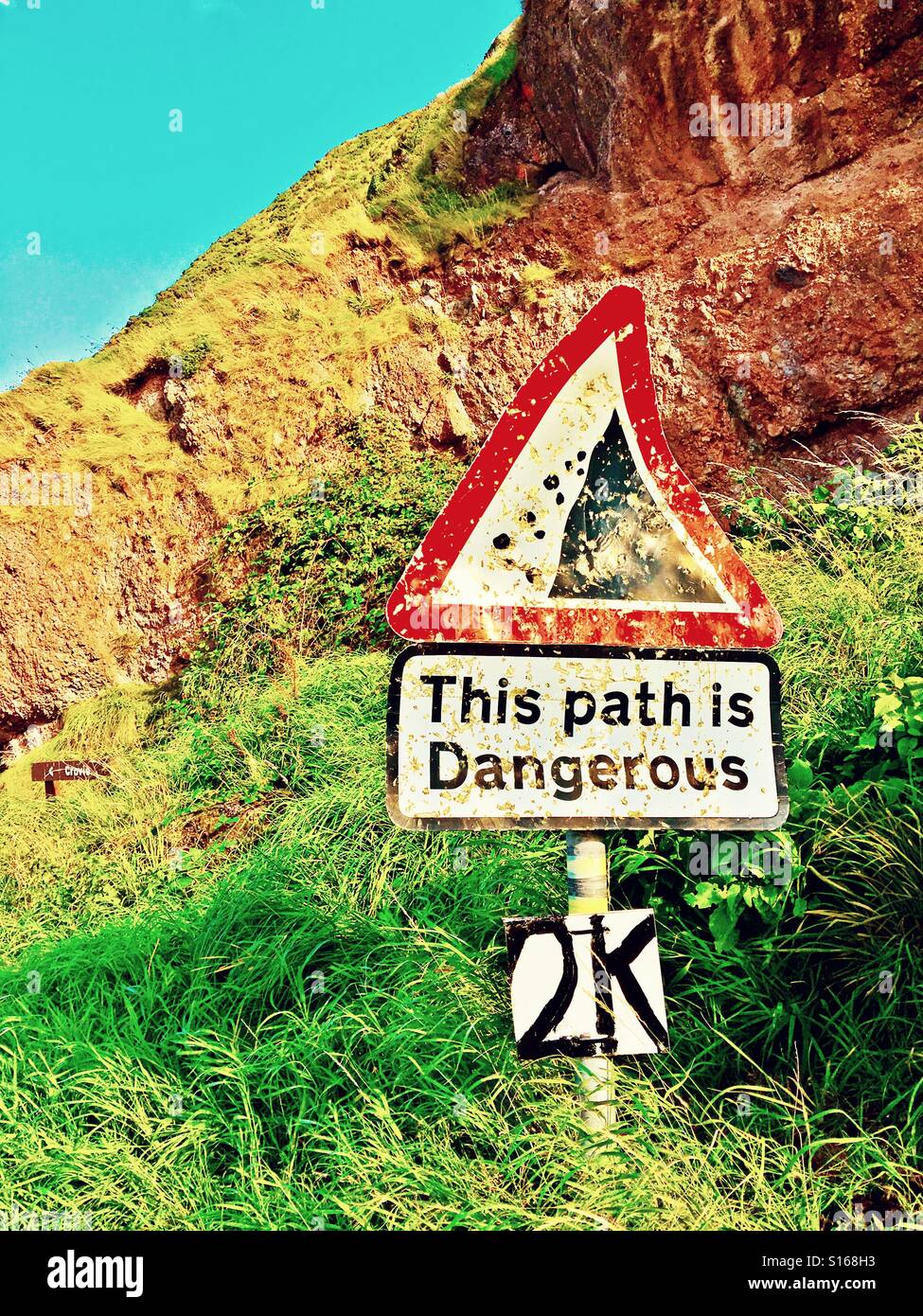 Warning sign on footpath across the cliffs from Gardenstown to Crovie ...