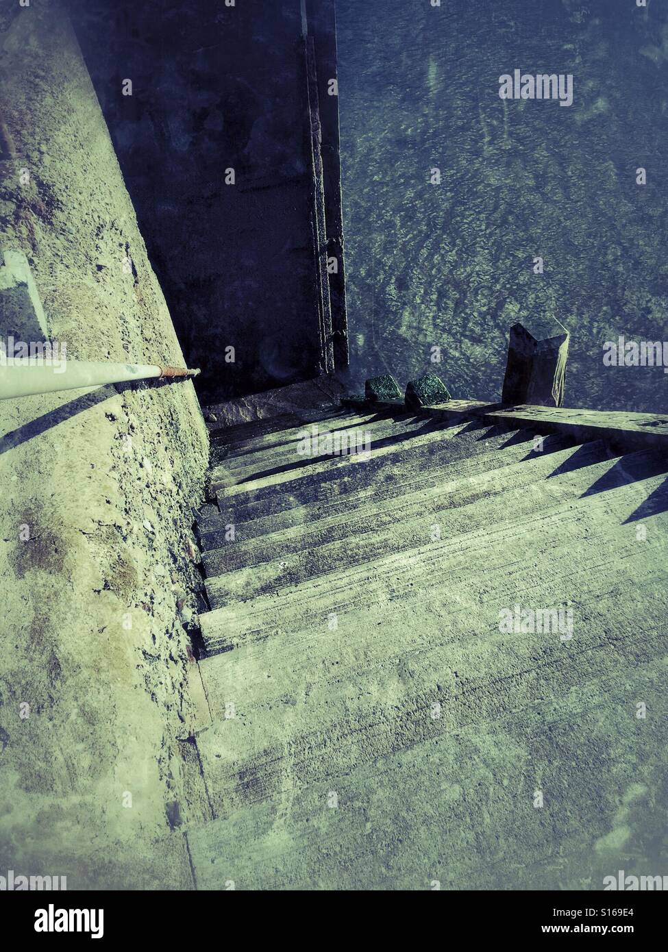 Steep harbour steps leading down to the sea Stock Photo - Alamy