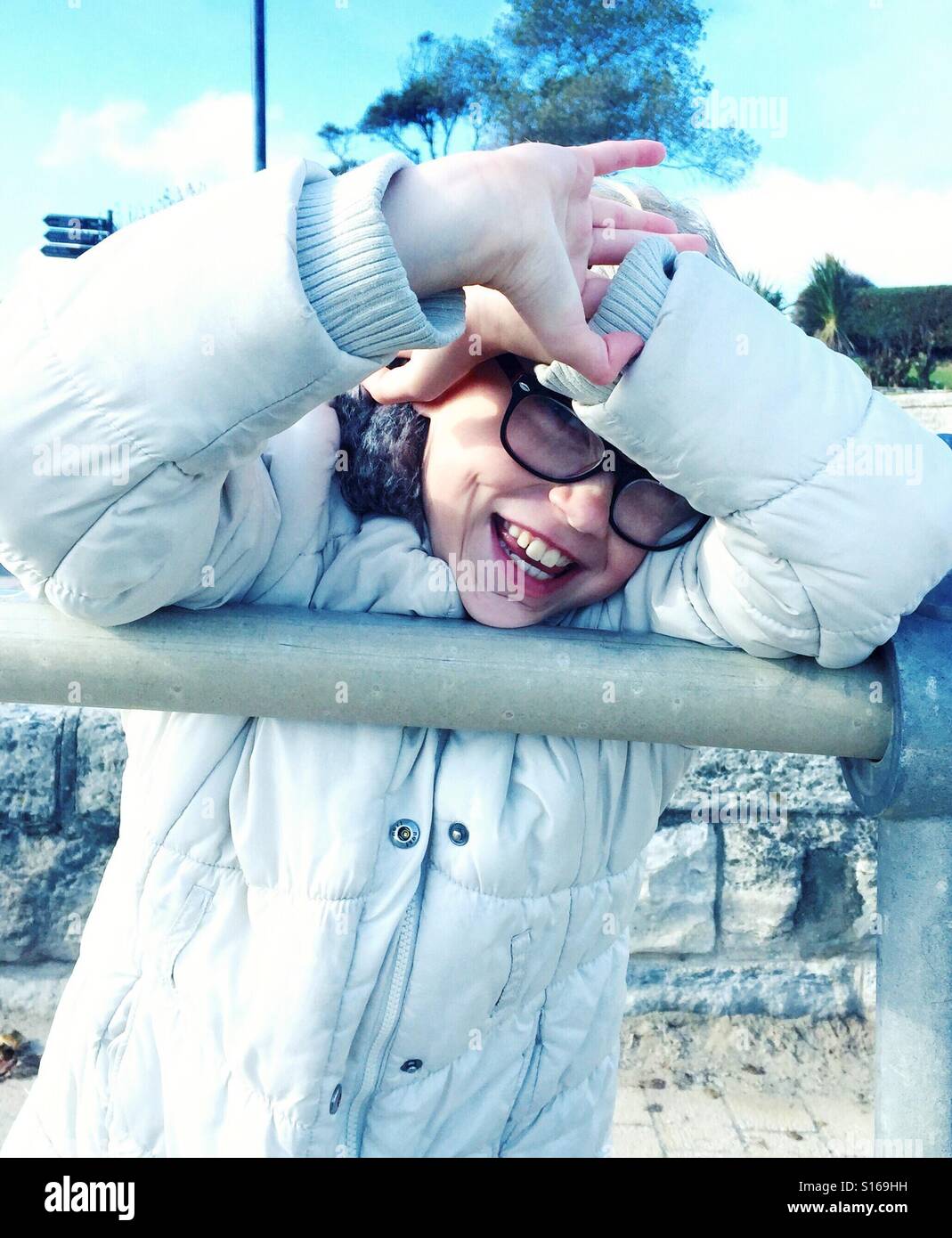 Girl hiding face from camera Stock Photo - Alamy