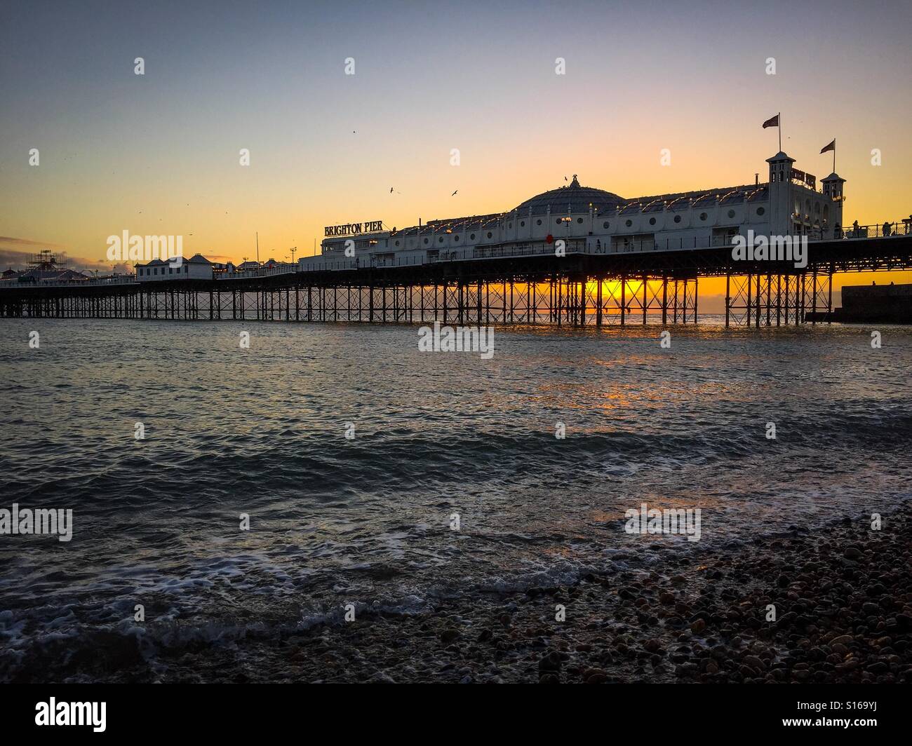 Brighton pier at sunset hi-res stock photography and images - Alamy