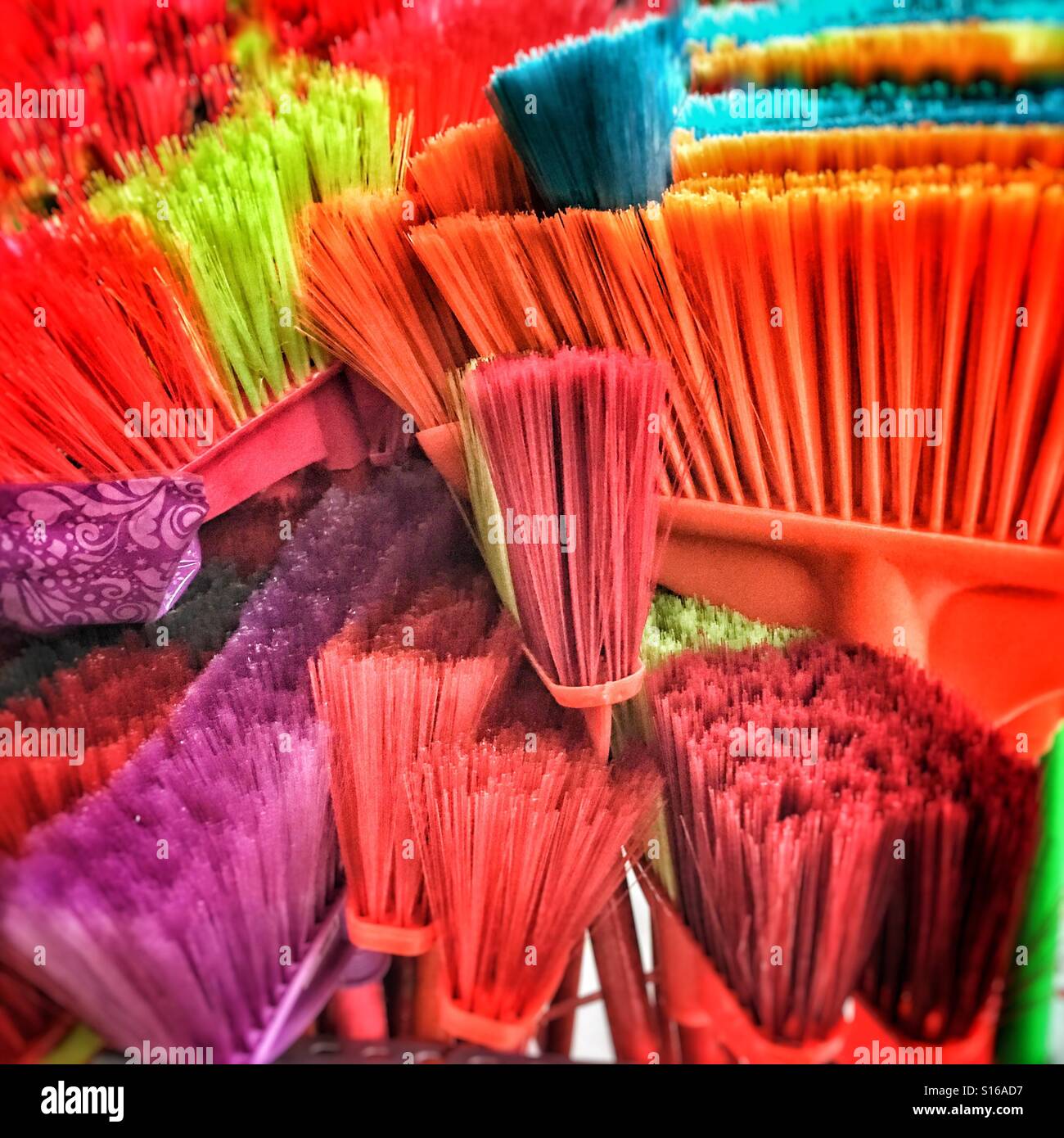 Colourful plastic brooms Stock Photo - Alamy