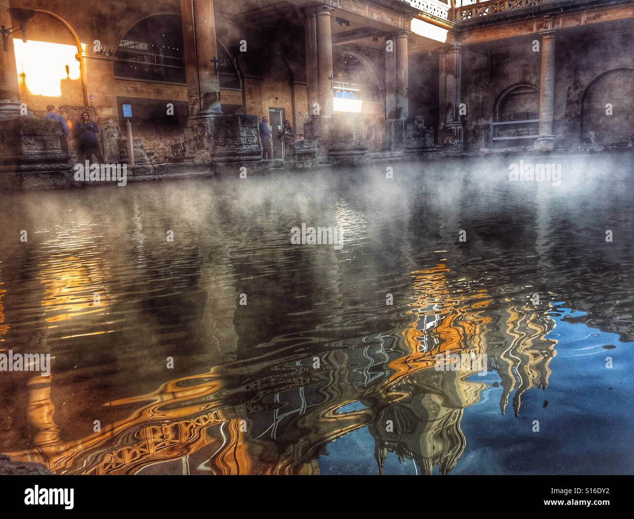 Steaming thermal waters of the Great Bath, the Roman Baths, Somerset ...