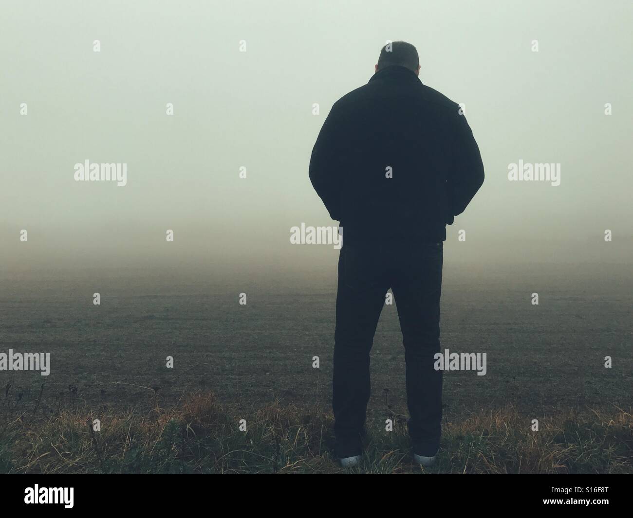 Man in the fog Stock Photo - Alamy