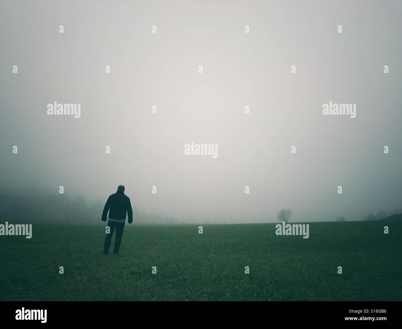 Man on the fog Stock Photo - Alamy