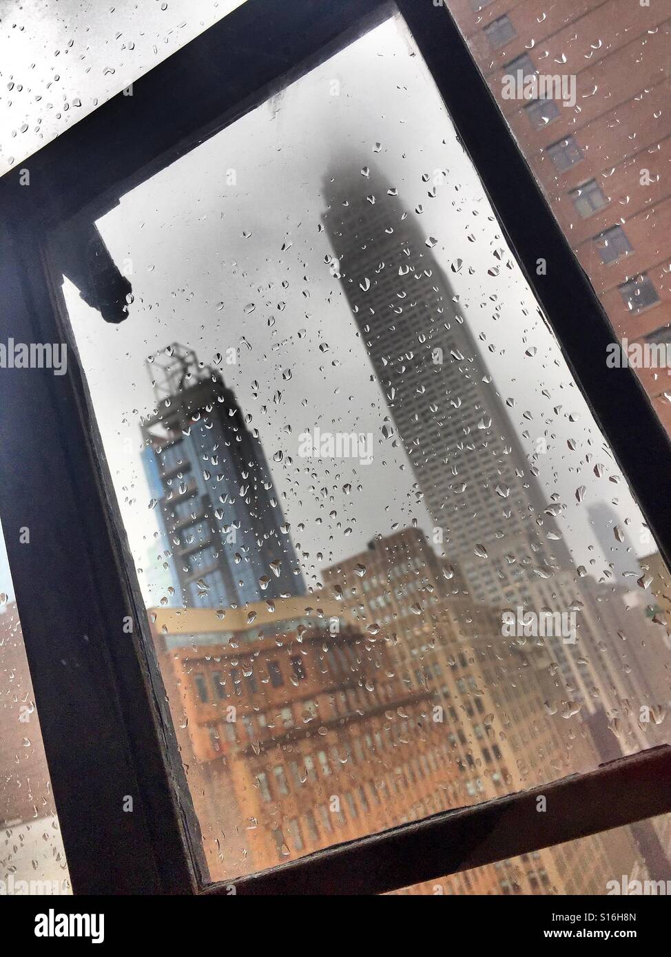 Empire state building through window hi-res stock photography and ...