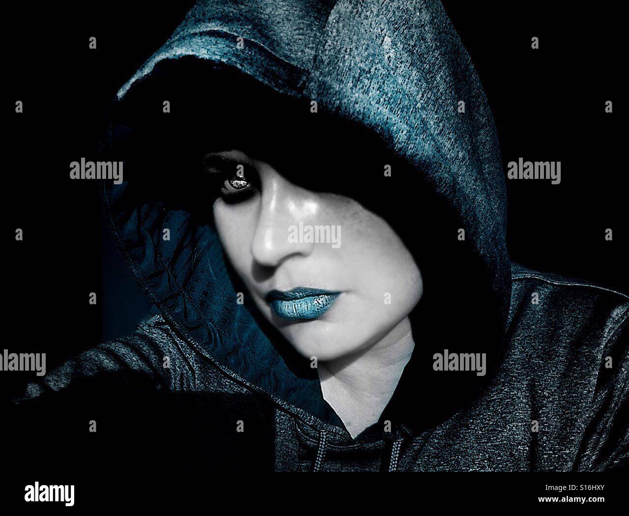 Creative dark portrait of young women in hoodie Stock Photo - Alamy