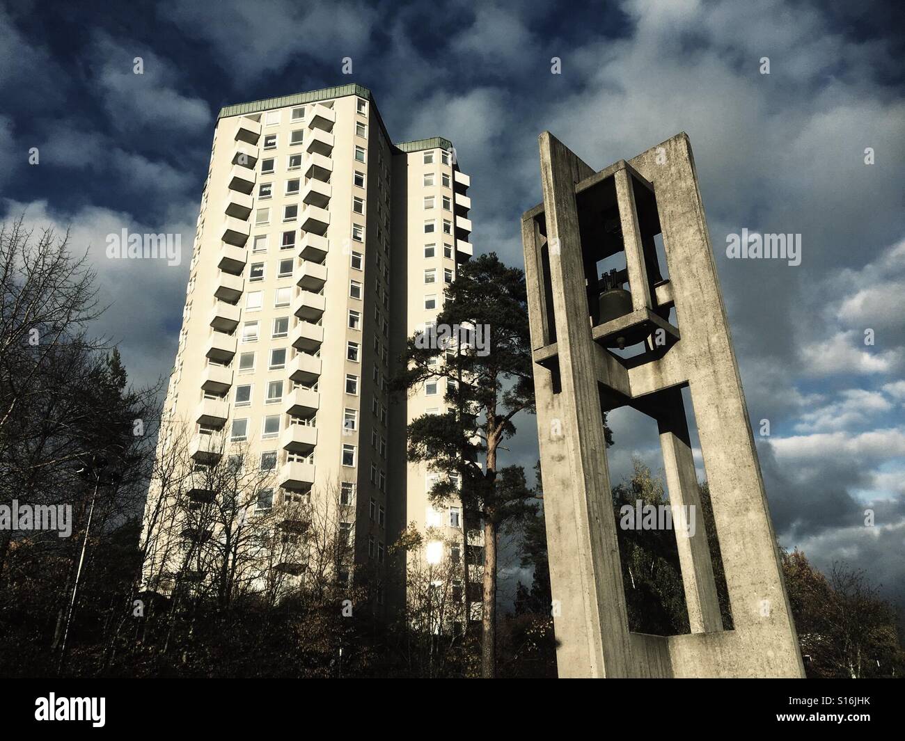 High rise building and church bell tower in Farsta, Stockholm, Sweden ...