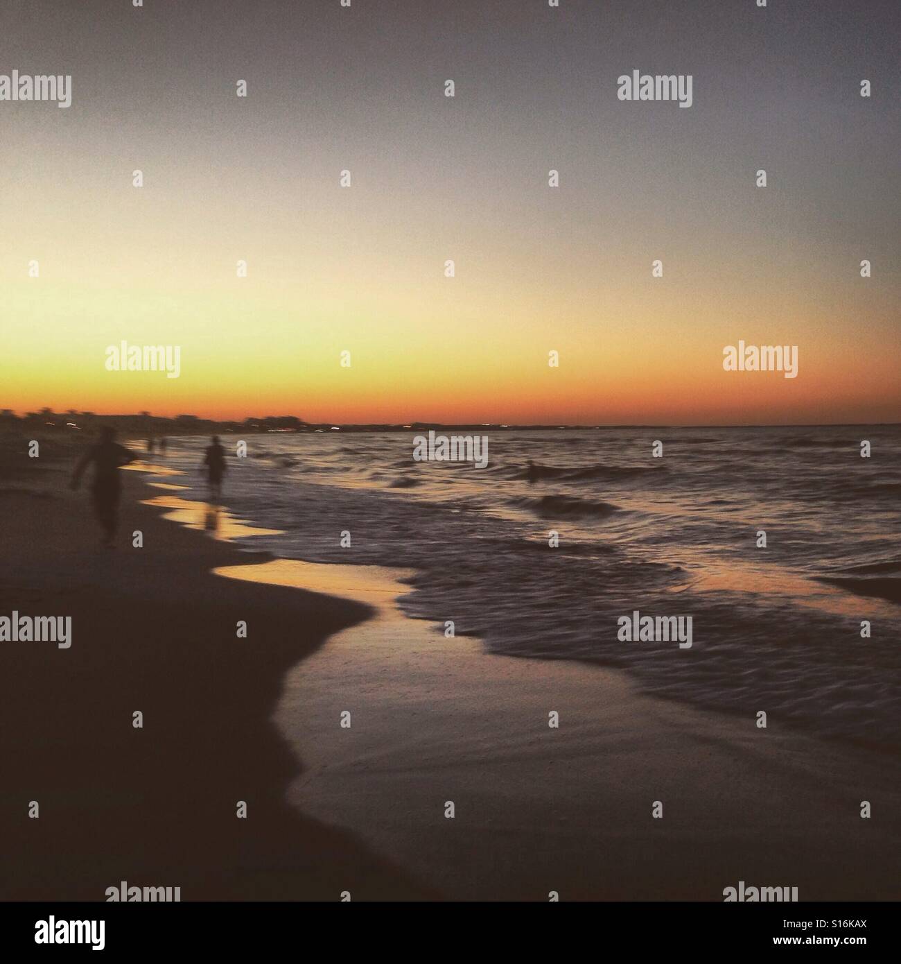 Sunset walk on the beach Stock Photo - Alamy