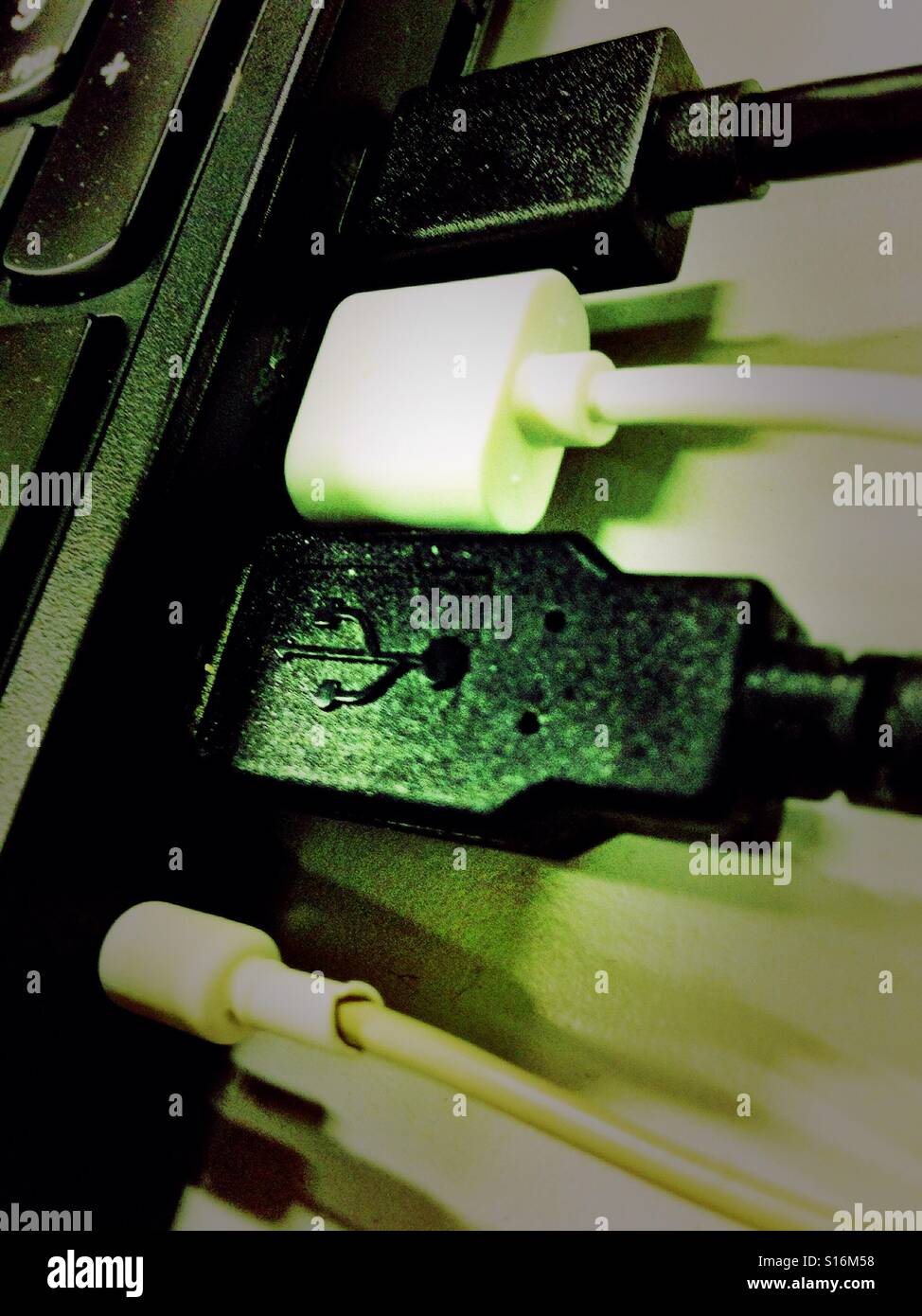 Leads plugged into the side of a laptop PC Stock Photo - Alamy