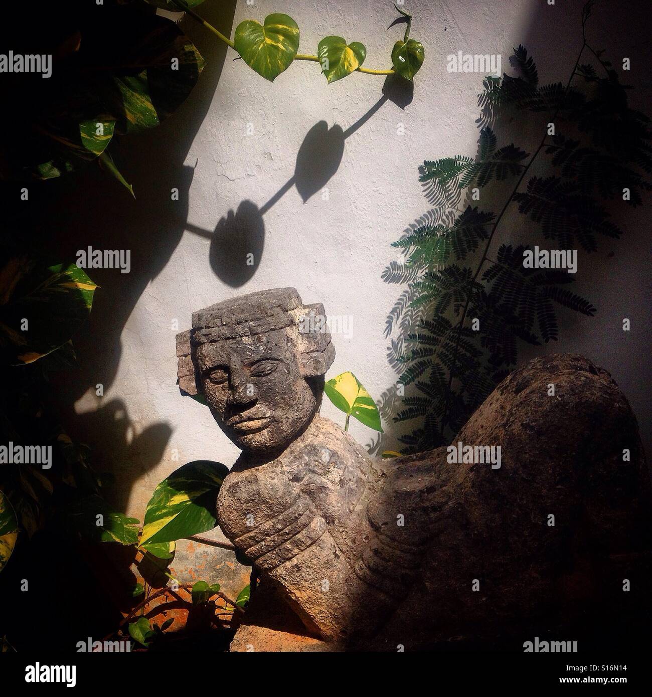 A sculpture of a Mayan Chac Mool decorates Hacienda Blanca Flor in ...