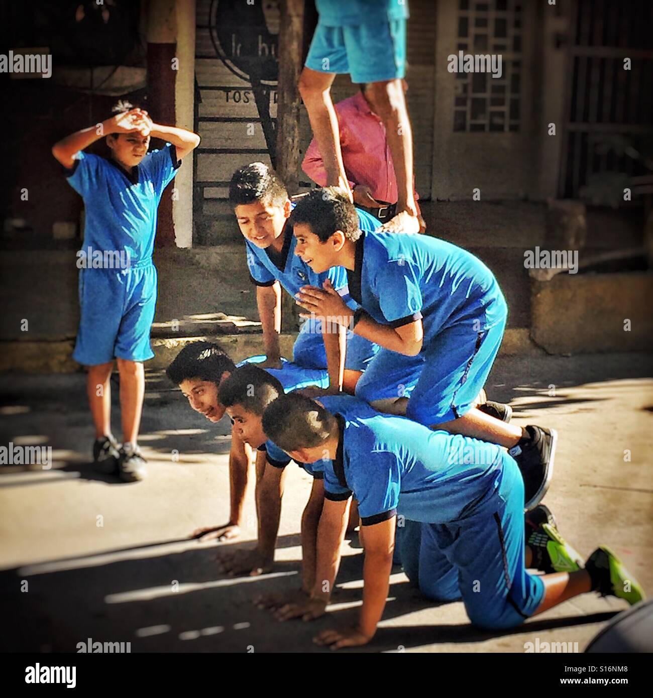 Boys form human pyramid hi-res stock photography and images - Alamy