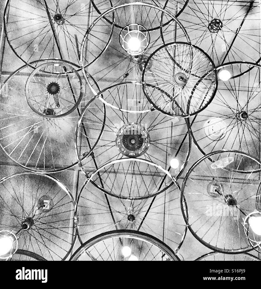 Bike wheel ceiling sculpture Stock Photo - Alamy