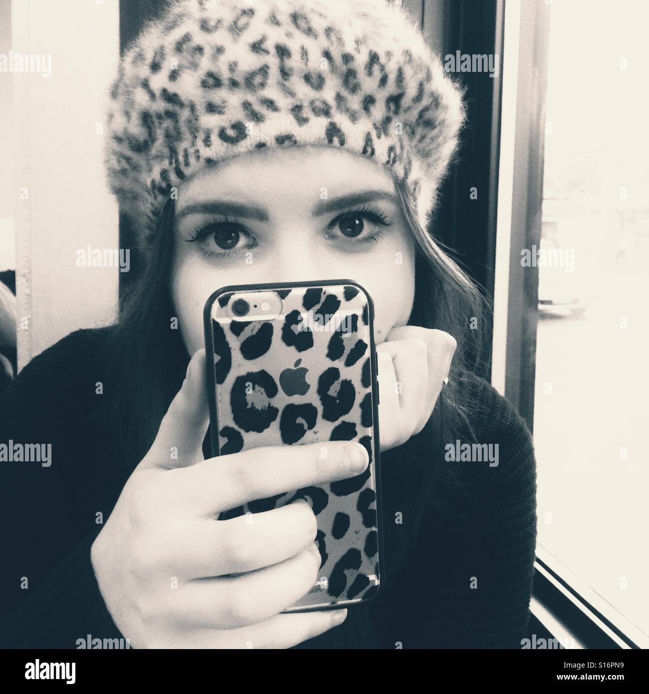 Young woman taking photograph with mobile phone Stock Photo - Alamy