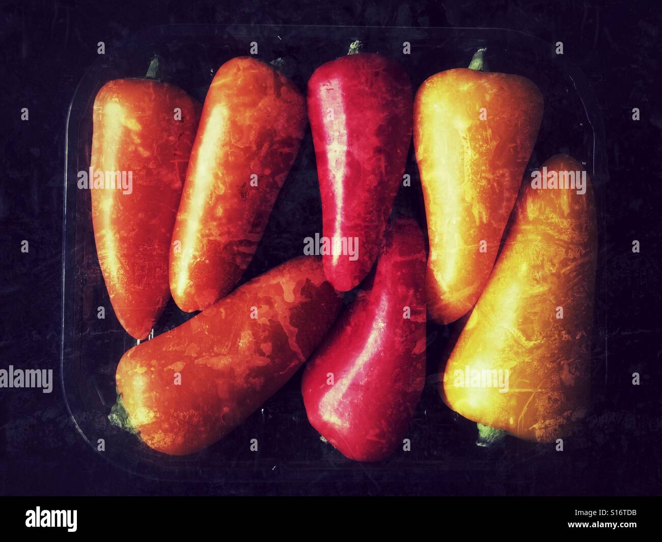 Fresh chilli peppers in a plastic punnet Stock Photo - Alamy