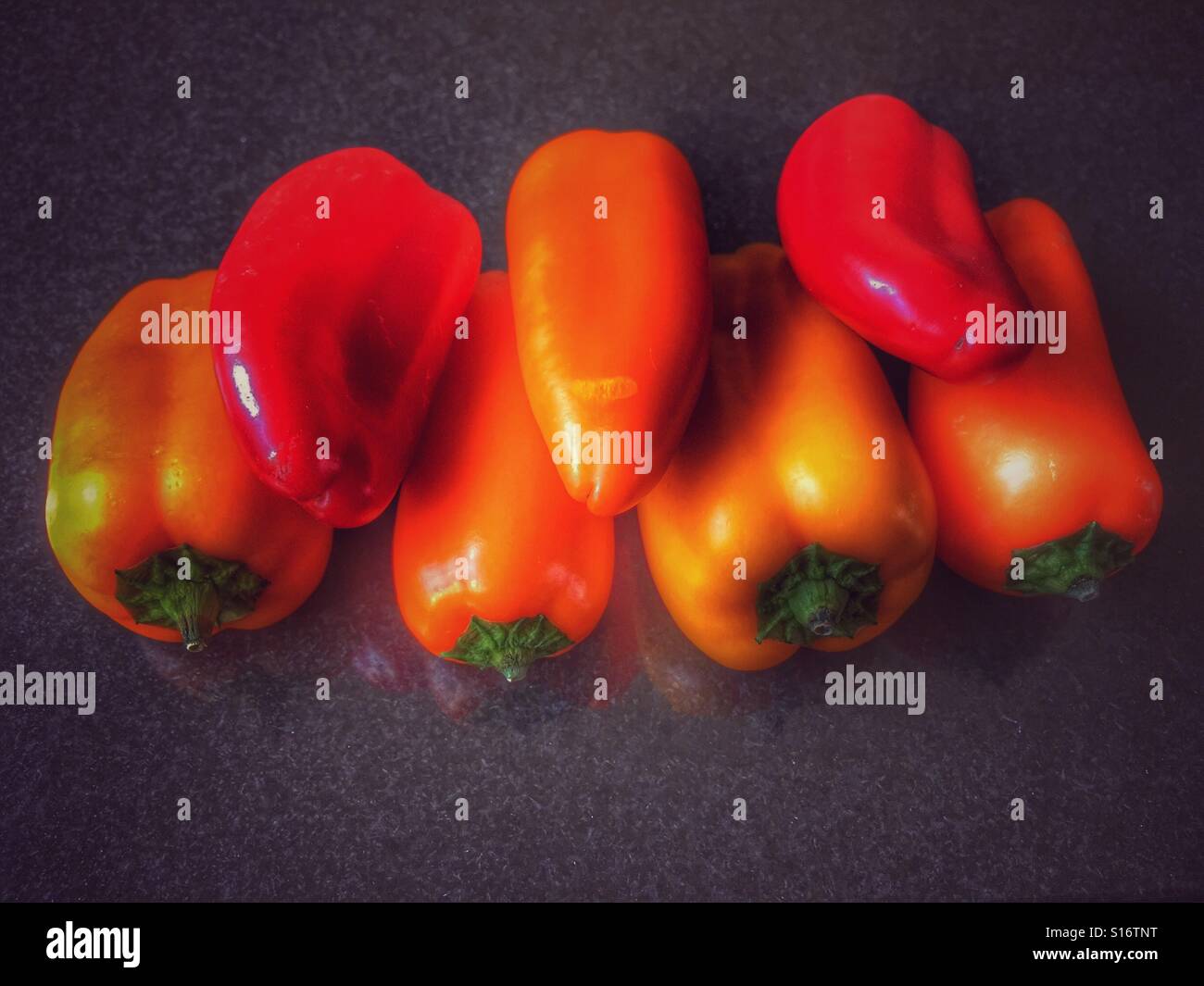 Red, orange and yellow chilli peppers Stock Photo - Alamy