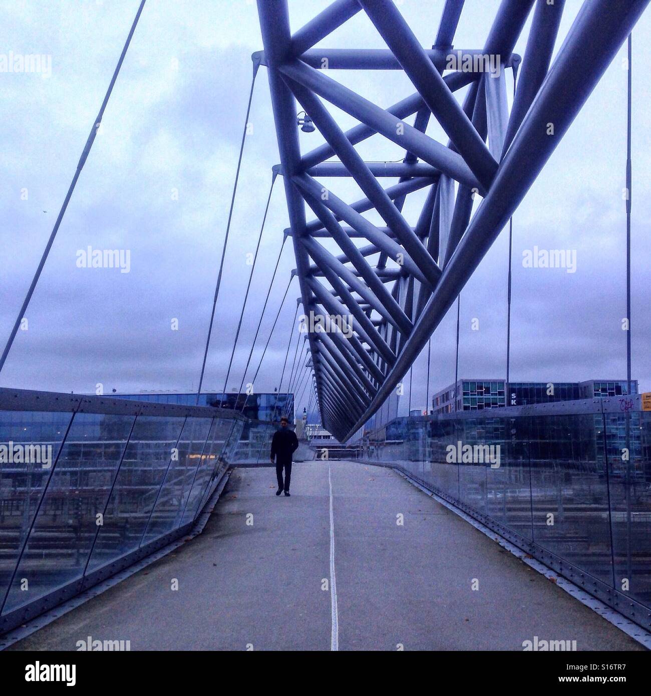 Walking on a bridge Stock Photo - Alamy