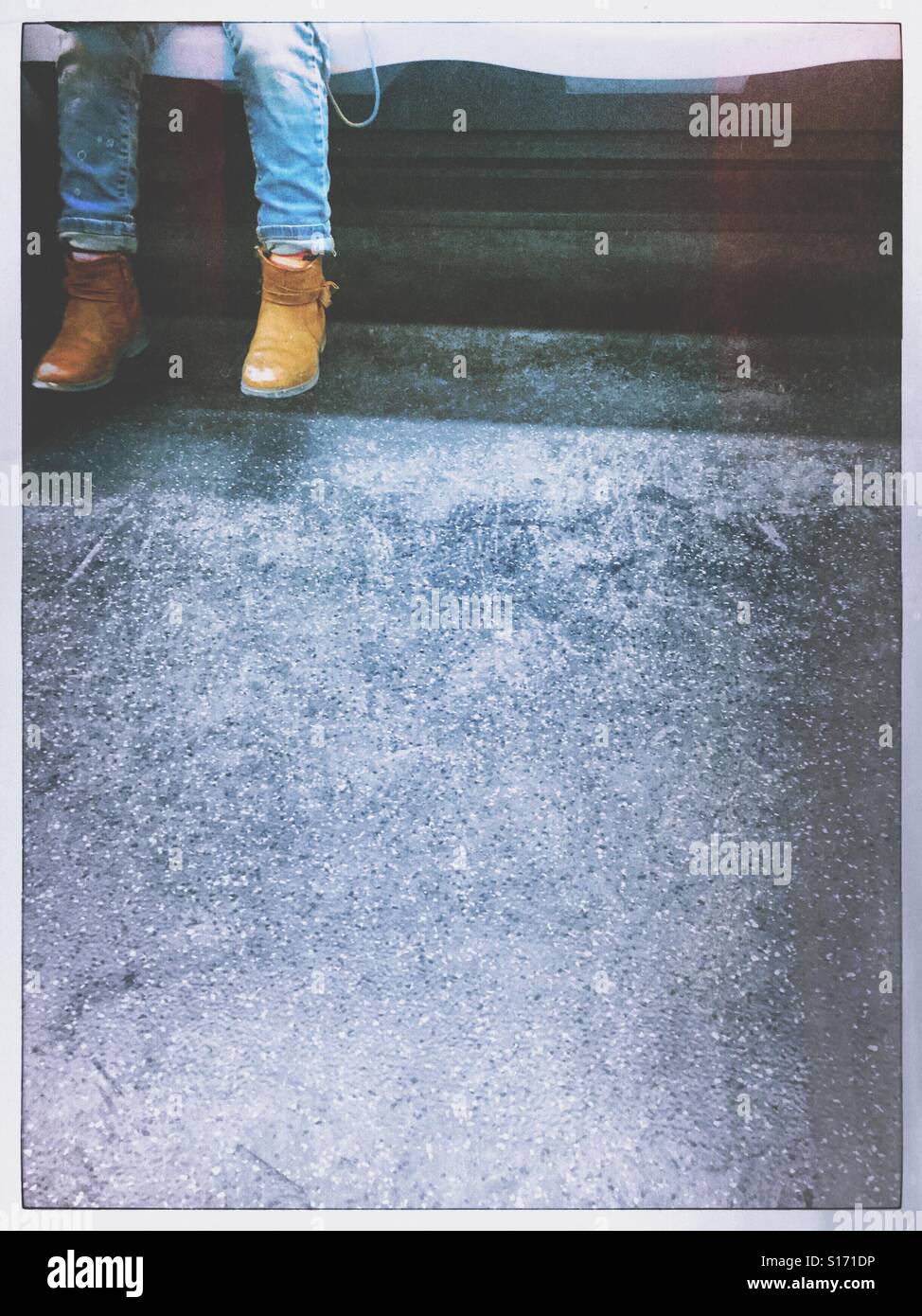 Kid sitting on a bench inside a subway car Stock Photo - Alamy