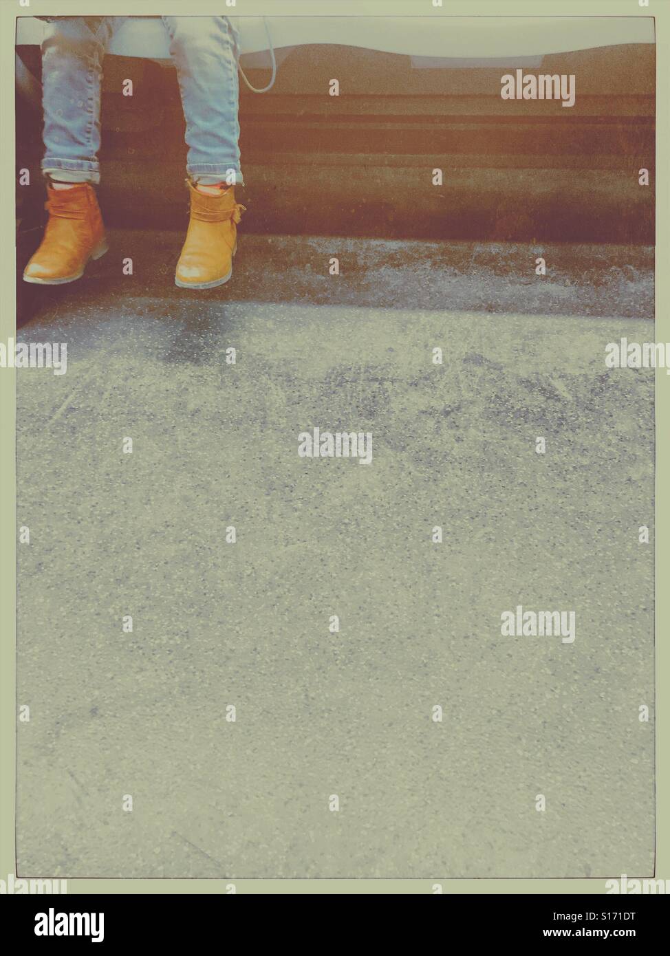 Kid sitting on a bench inside a subway car Stock Photo - Alamy