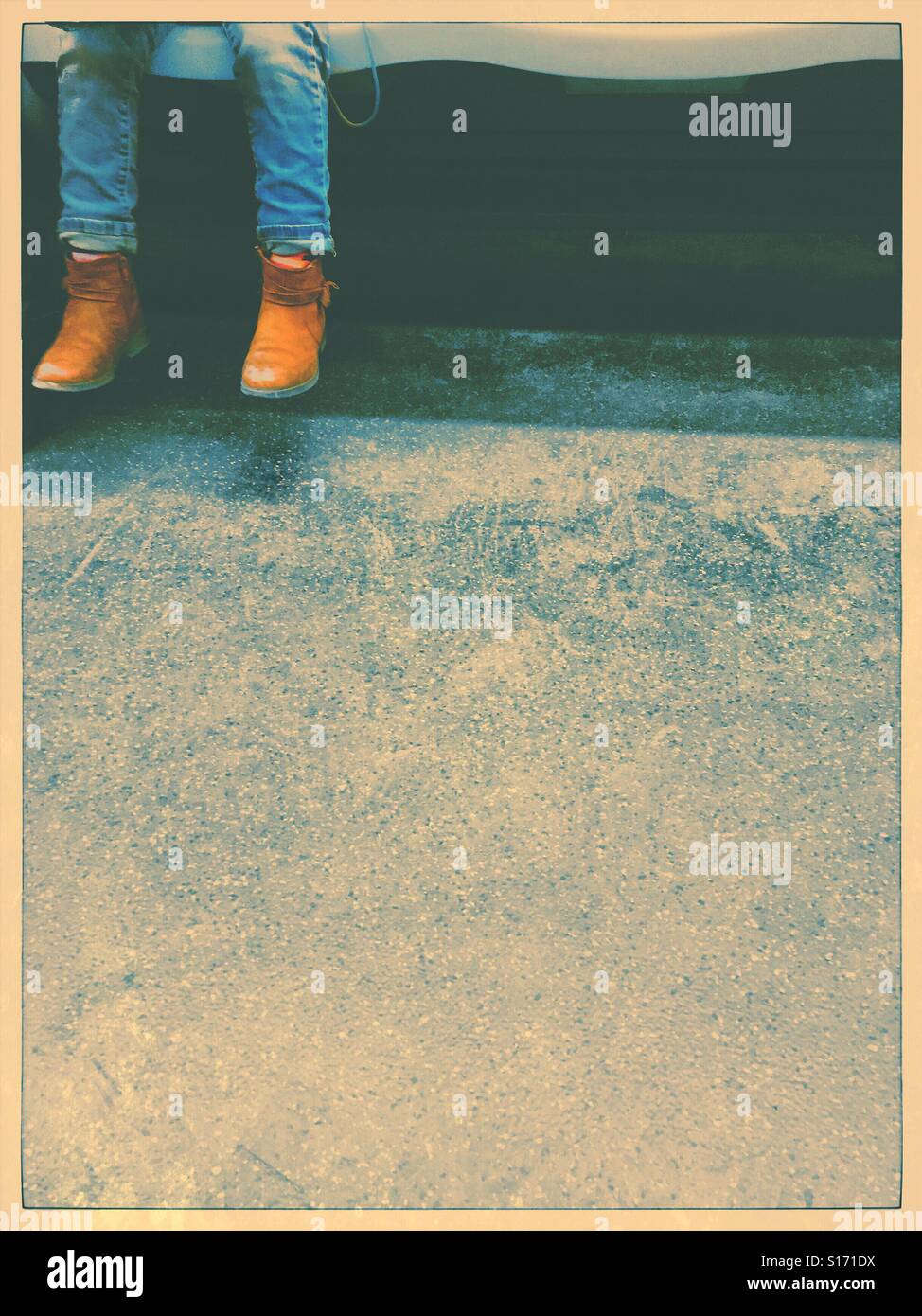 Kid sitting on a bench inside a subway car Stock Photo - Alamy