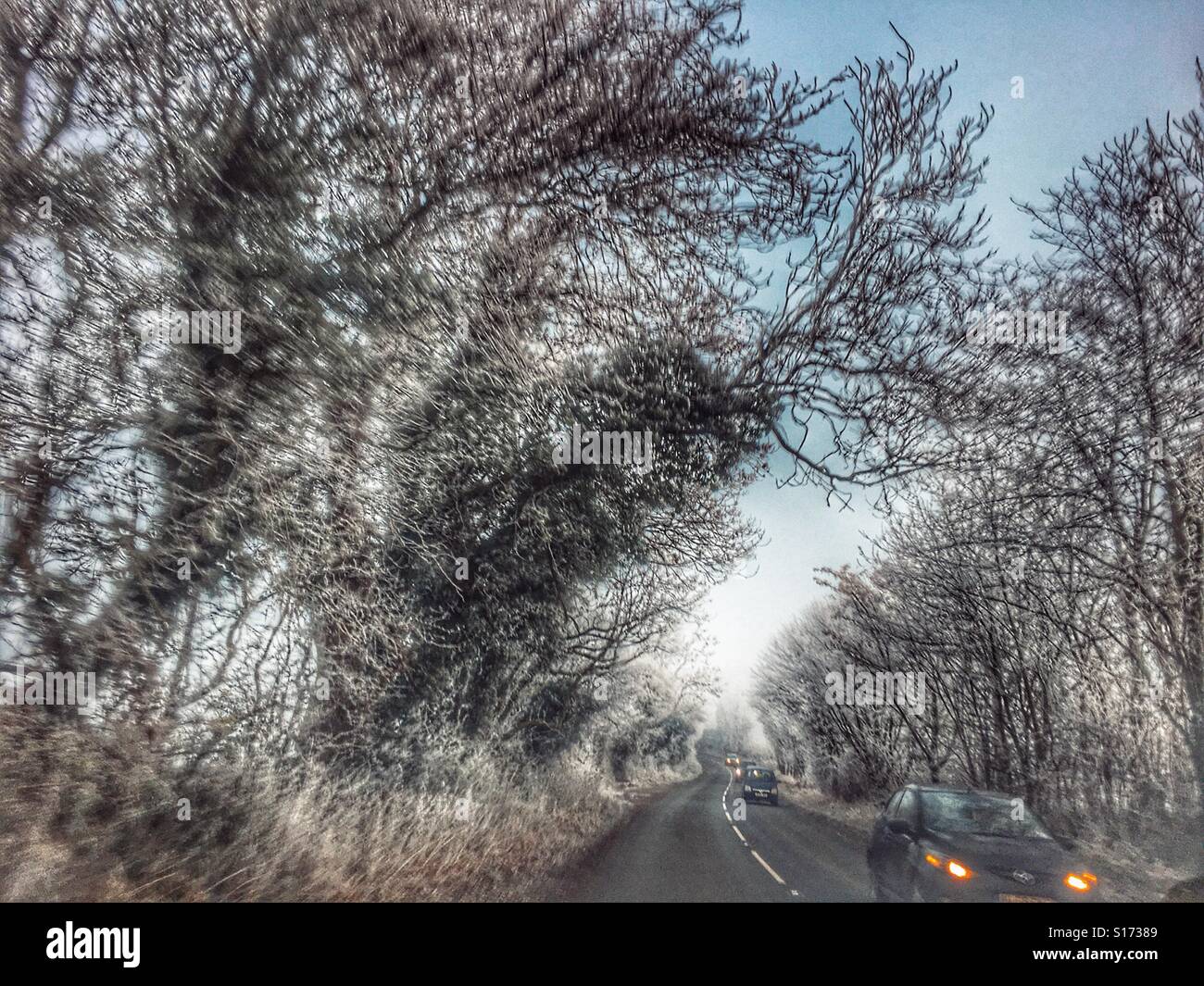 Driver's view through the front windscreen of car to the road ahead ...
