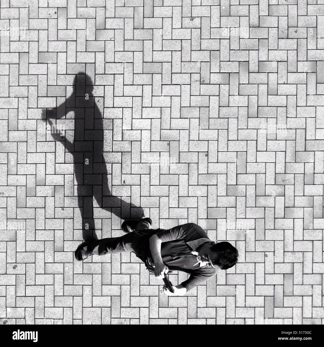 A photographer and his shadow Stock Photo - Alamy