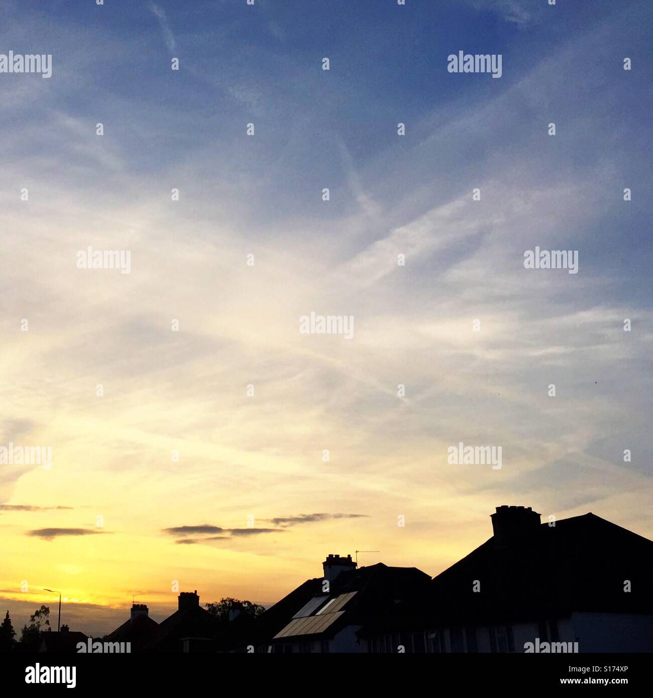 Contrails at sunset hi-res stock photography and images - Alamy