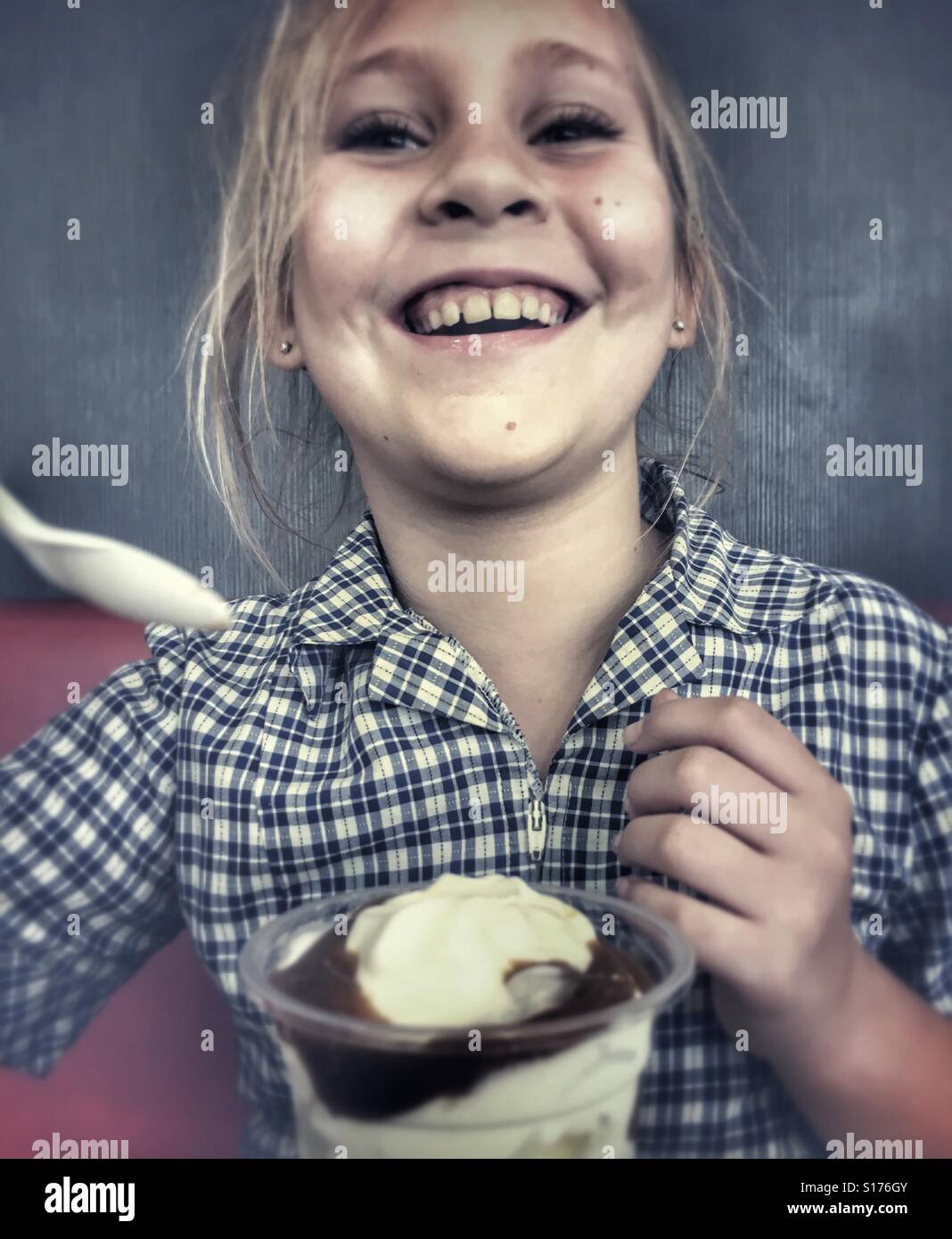 Young girl eating ice-cream Stock Photo - Alamy