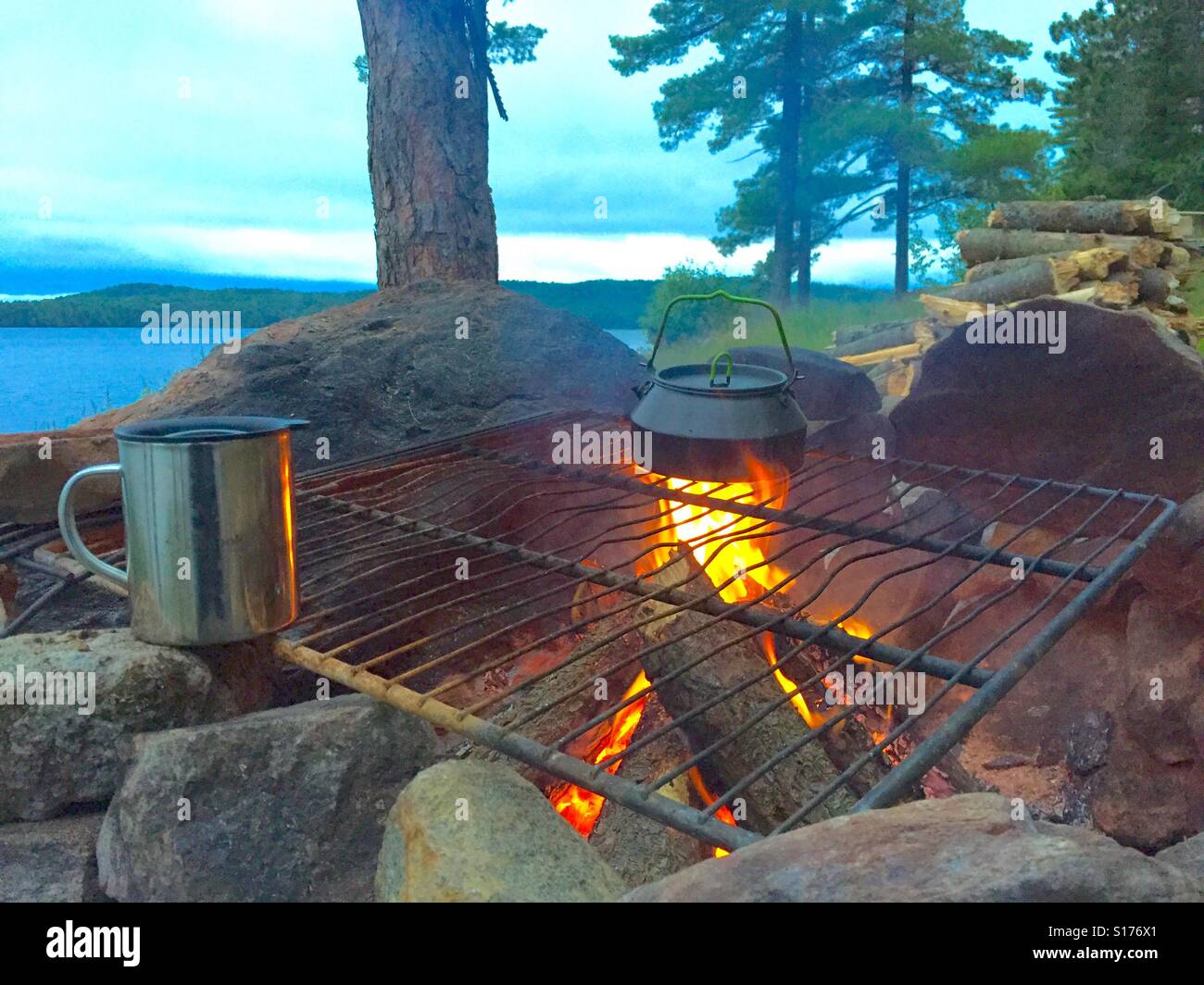 Boiling Pot Over Campfire At Lake Stock Photo - Alamy