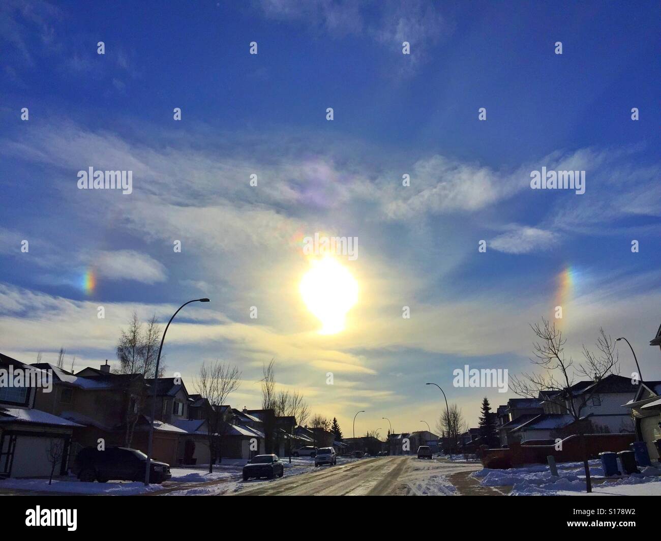Bright sun with two sun dogs Stock Photo - Alamy