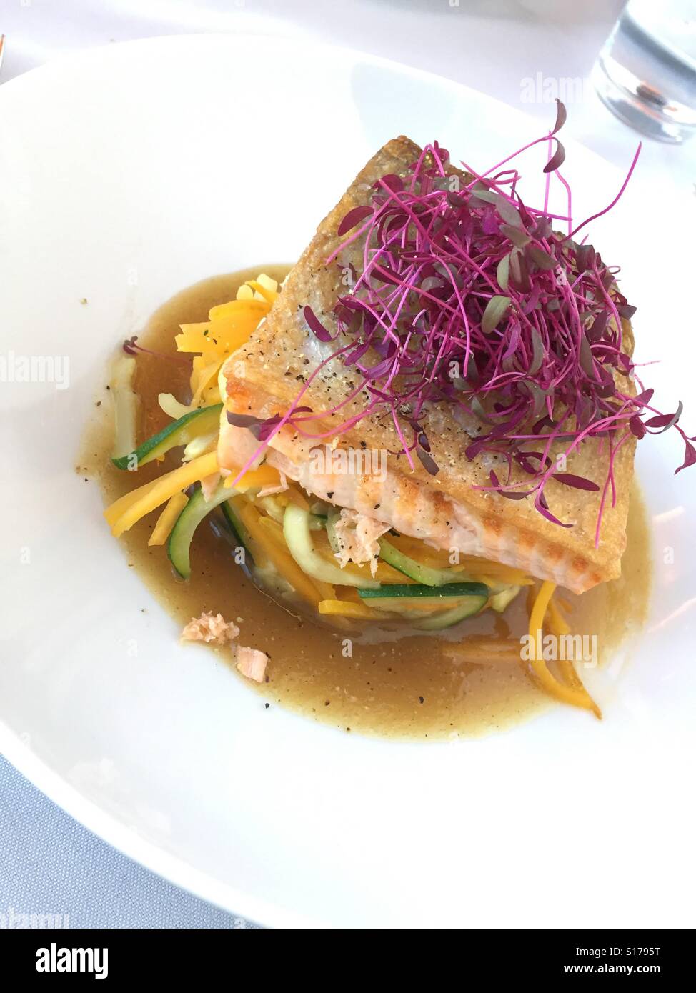 Entrée of seared salmon at upscale luxury restaurant in NYC Stock Photo ...