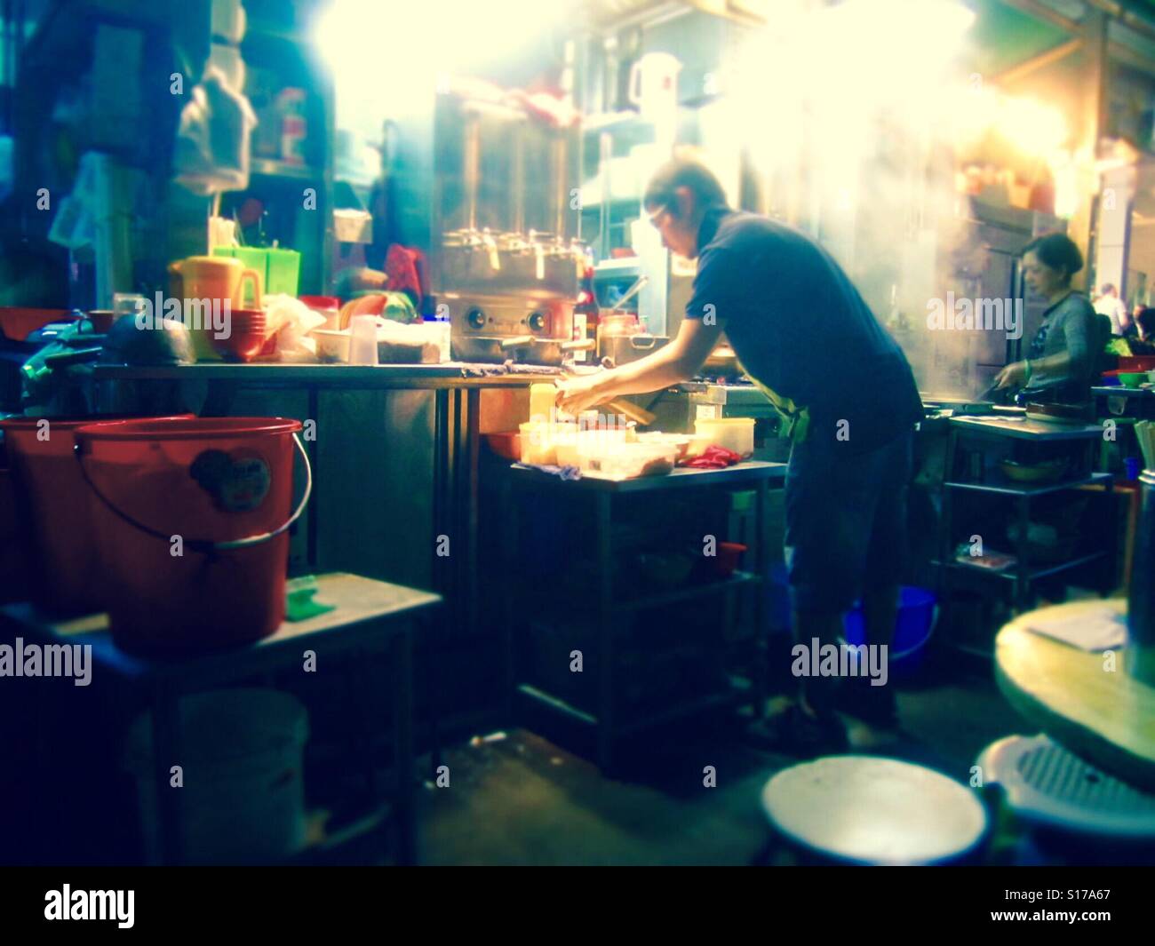 Street vendor cooking food in Hong Kong Stock Photo - Alamy