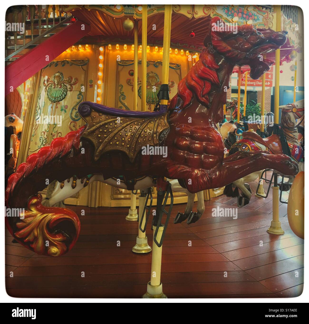 Dragon merry go round Stock Photo - Alamy