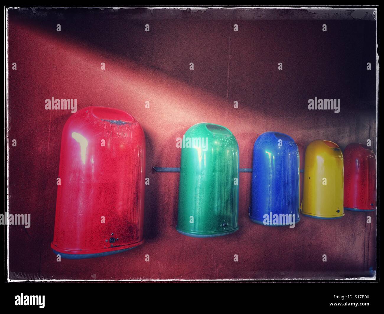 Recycling bins wall mounted Stock Photo - Alamy