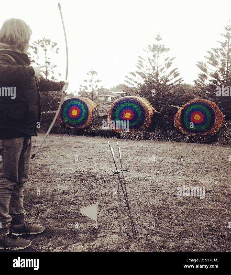 Boy playing archery in winter Stock Photo - Alamy