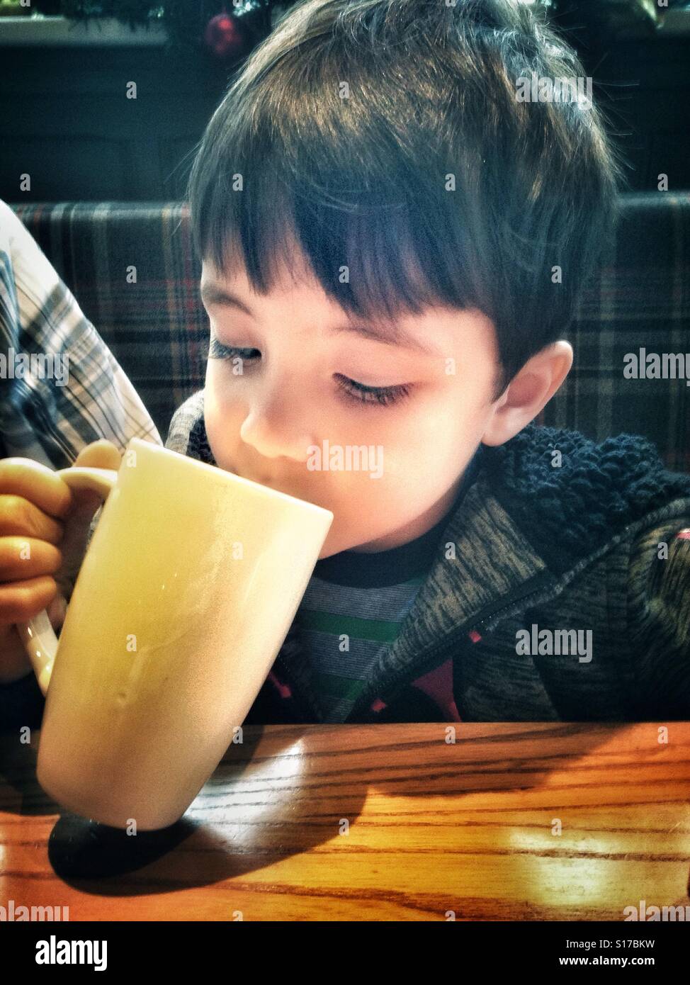 Young boy drinking from beaker hi-res stock photography and images - Alamy
