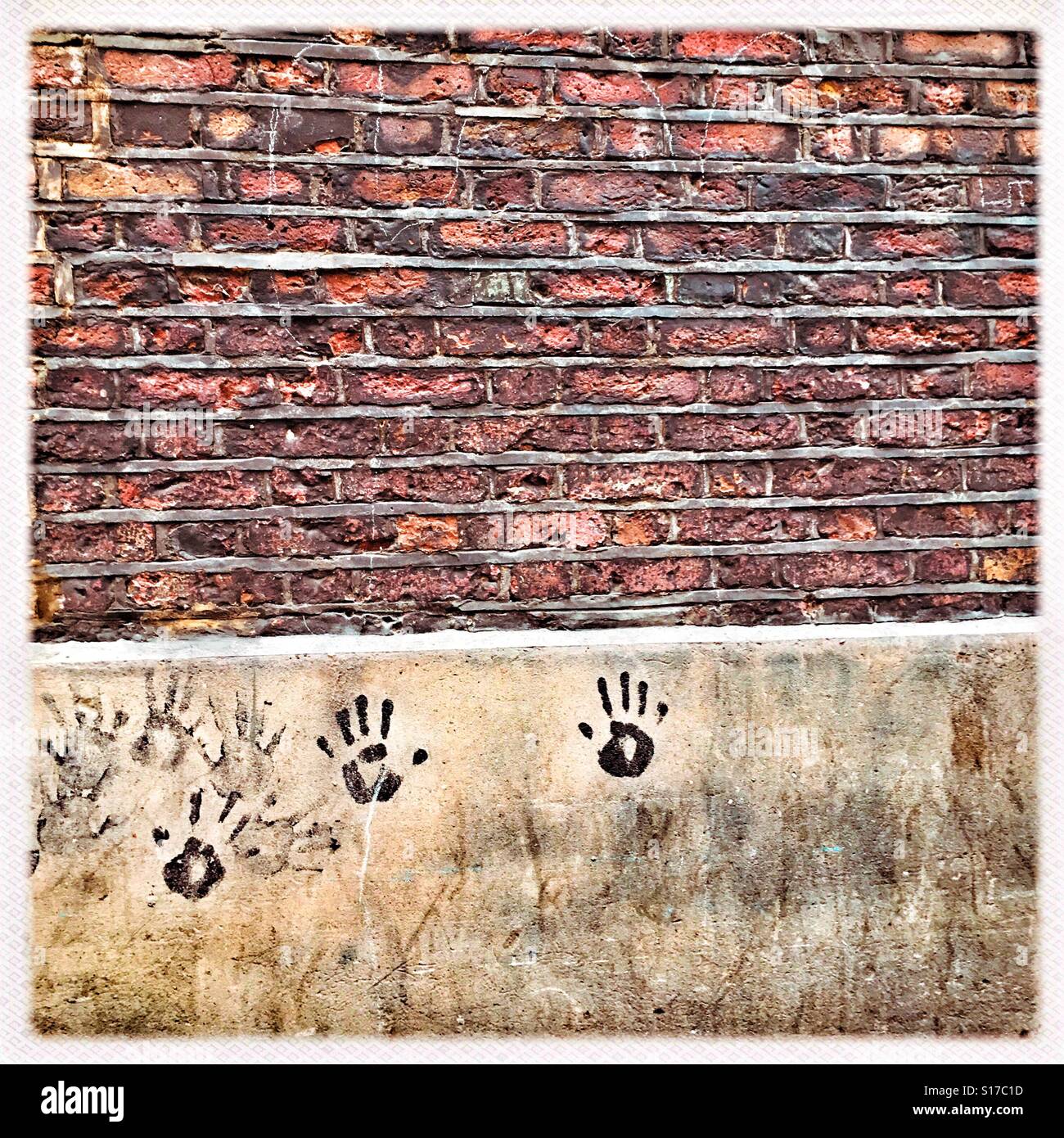 Hands on a wall hi-res stock photography and images - Alamy