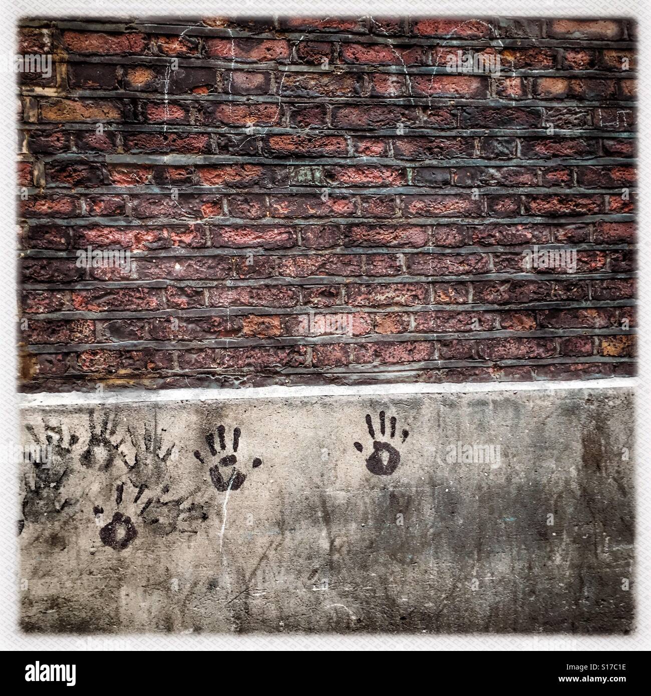 Hands on a wall hi-res stock photography and images - Alamy