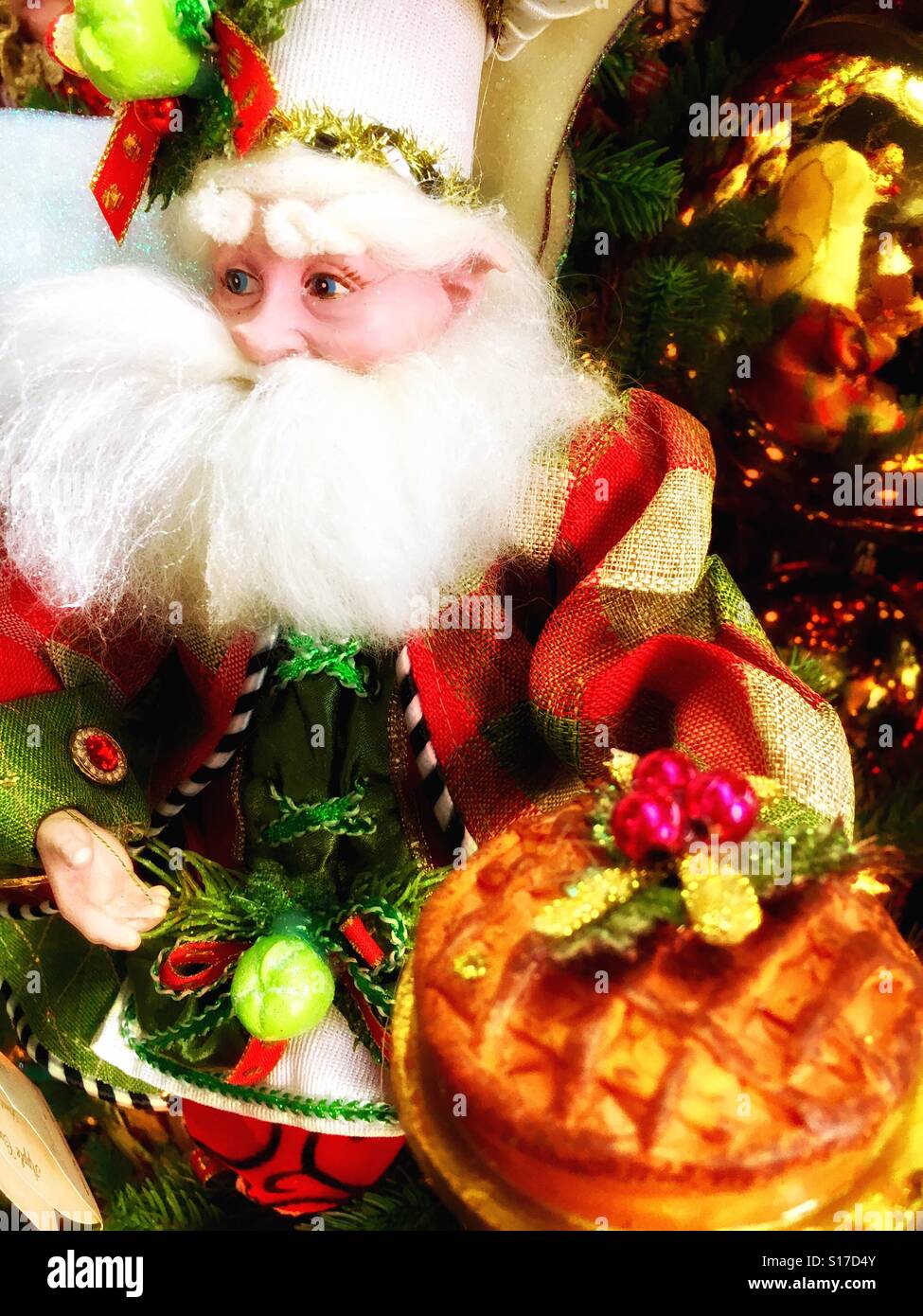 Christmas elf with Christmas cake Stock Photo - Alamy