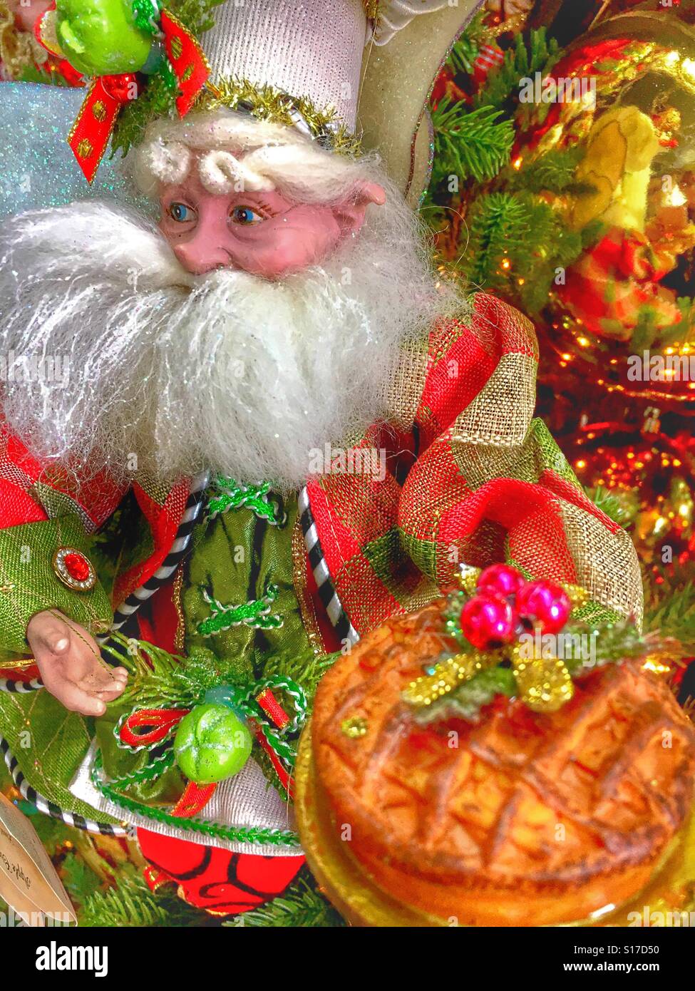 Christmas elf with Christmas cake Stock Photo - Alamy